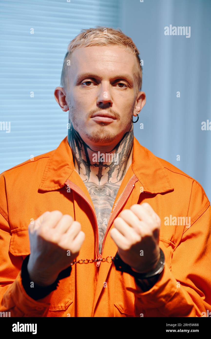 Portrait of arrested suspect showing hands with handcuffs Stock Photo ...