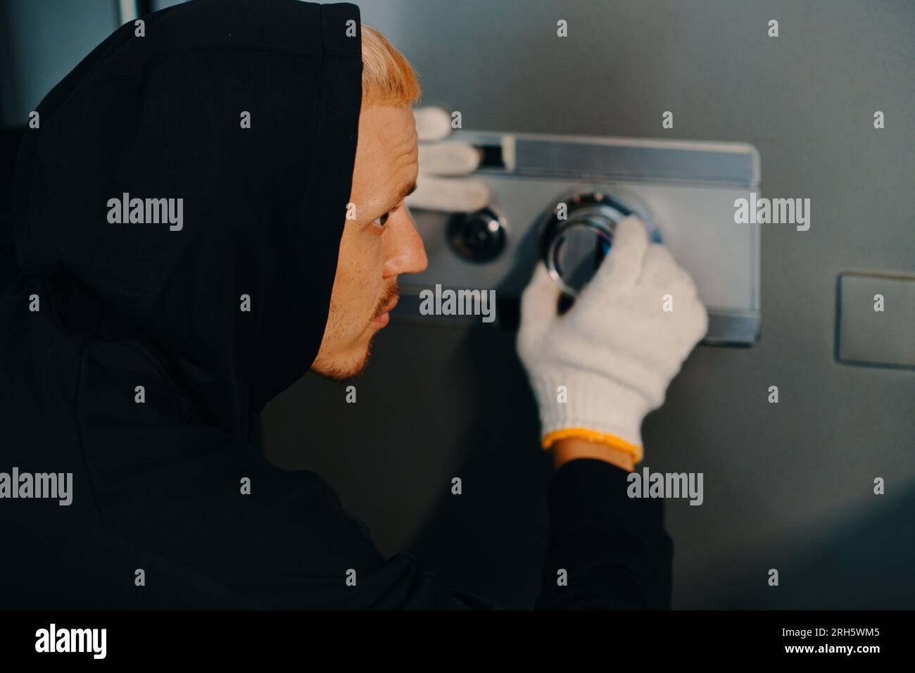 Burglar thief trying open safe hi-res stock photography and images - Alamy