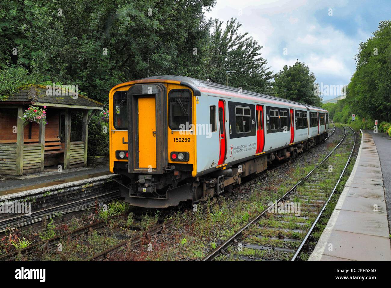 Class 150 two carriage diesel train stopped at Llanwrtyd Wells Station ...