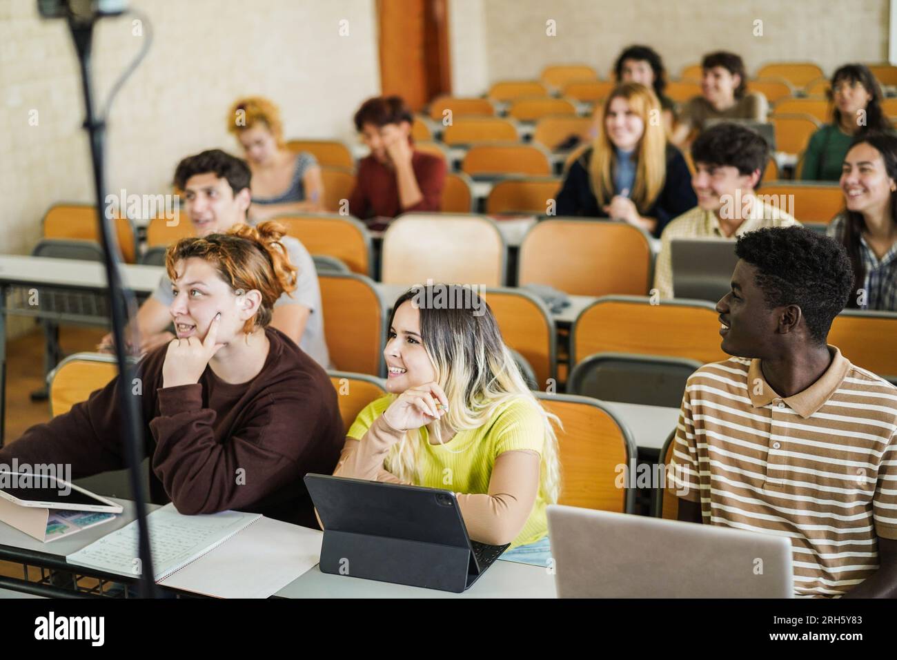 Students smiling inside university class room - Back to school concept ...