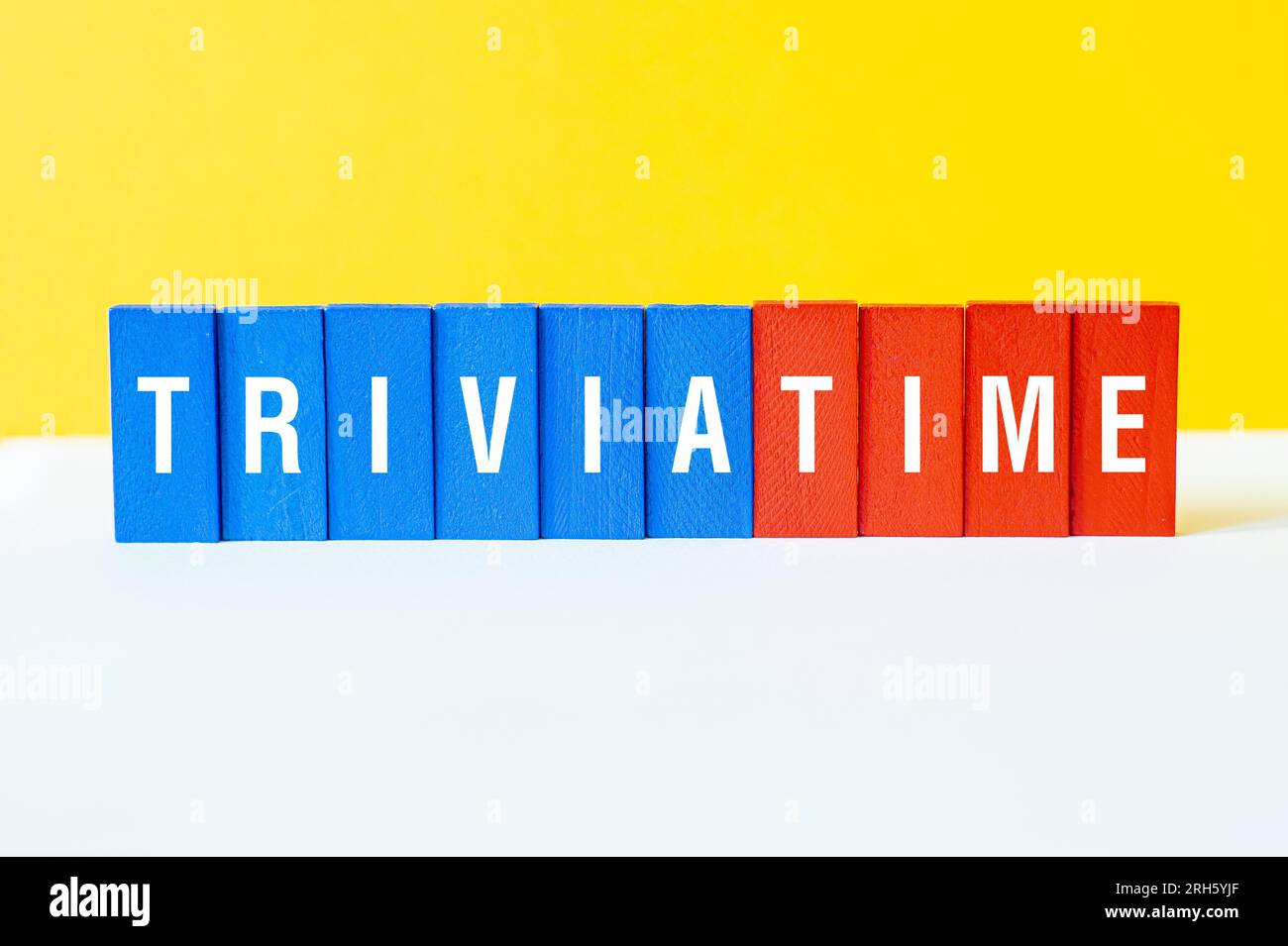 Trivia time - word concept on building blocks, text Stock Photo - Alamy