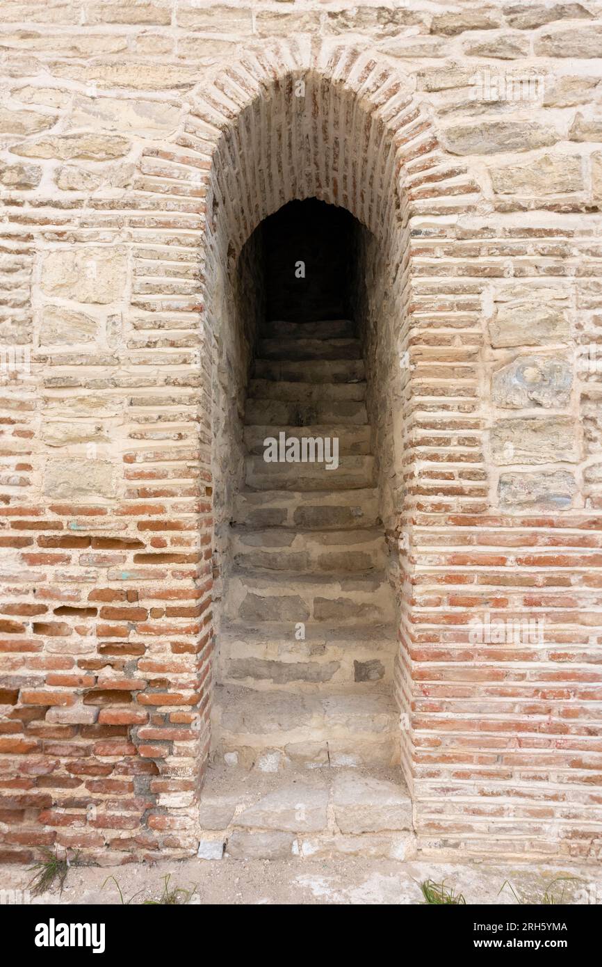 photo of narrow entrance with stairs up to castle Stock Photo - Alamy