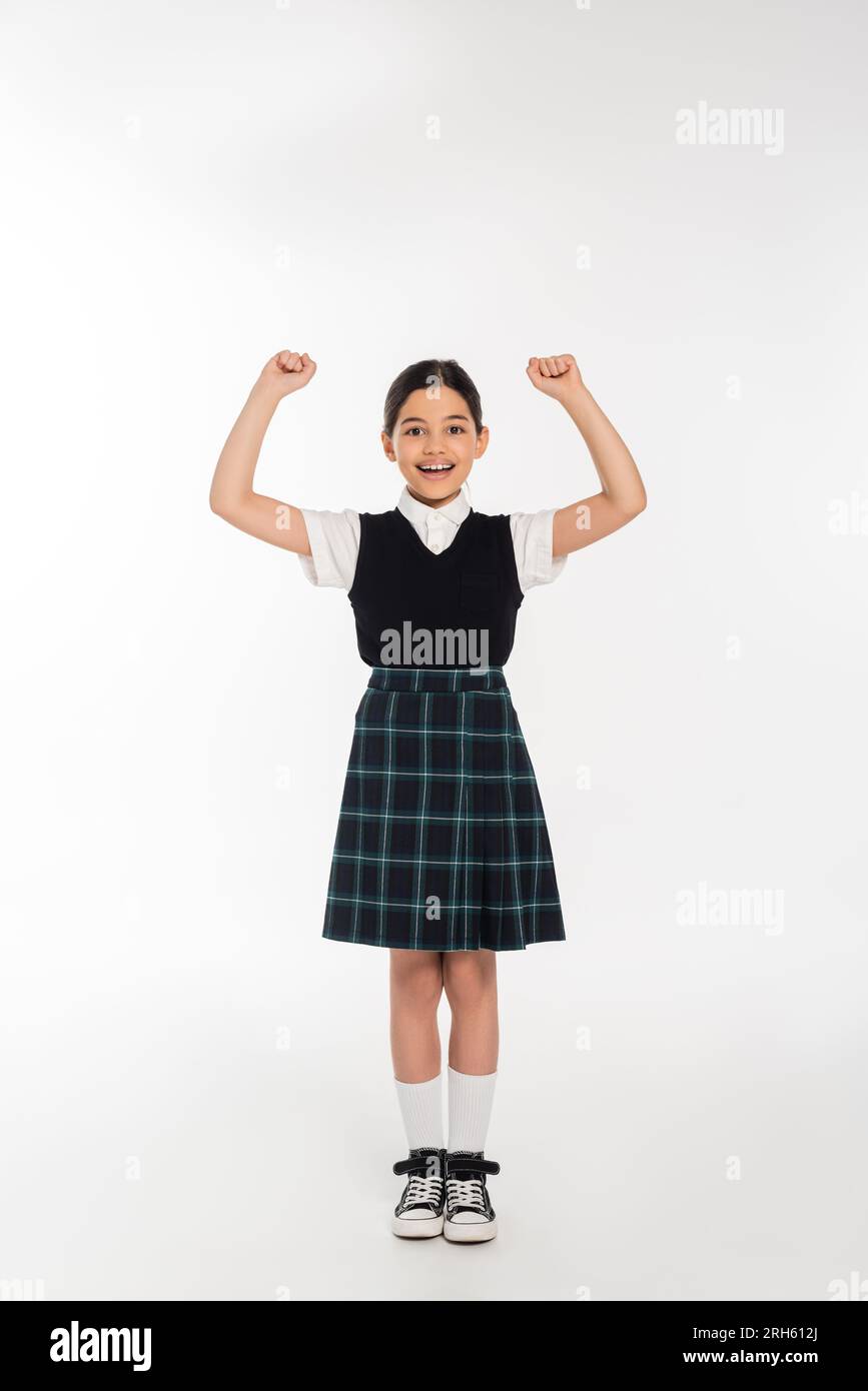 excitement, happy schoolgirl celebrating back to school, isolated on ...