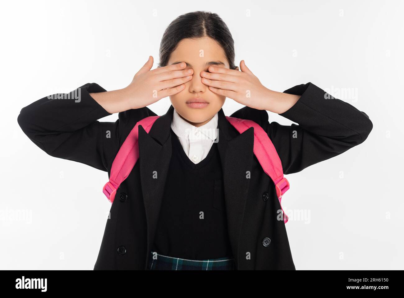 schoolgirl in uniform covering eyes isolated on white, student in ...
