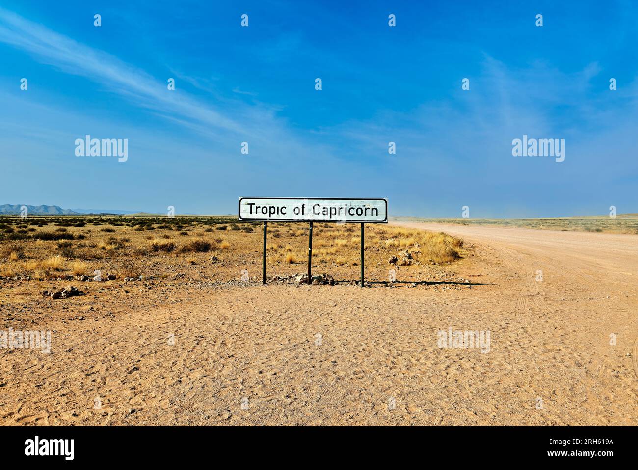 Namibia. Driving on a dirt road, crossing the Tropic of Capricorn Stock ...