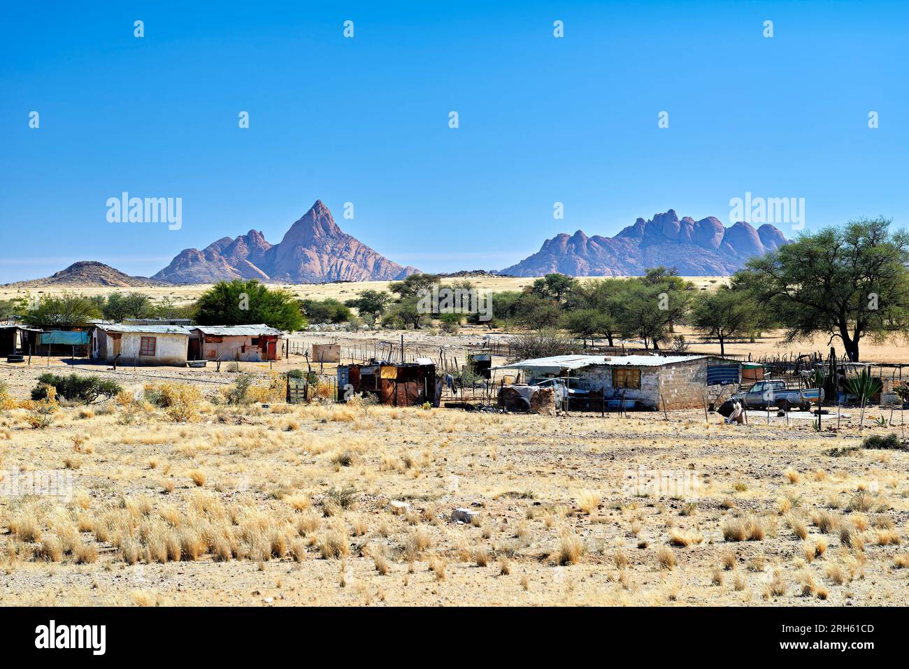 Namibia. A village by Spizkoppe granite peaks in the Namib Desert Stock ...
