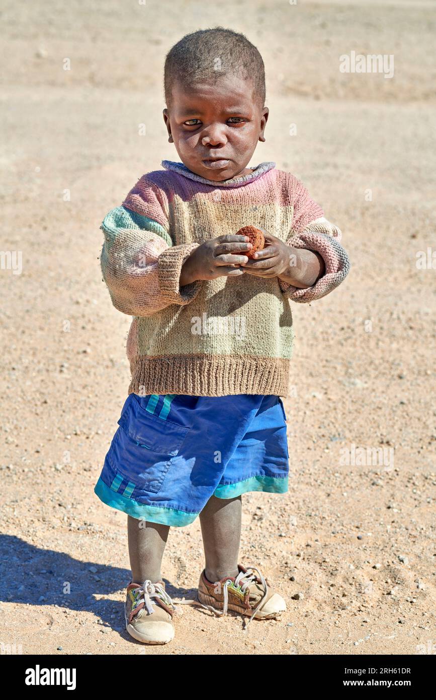 Namibia. Portrait of a sad child in a village of Damaraland Stock Photo ...