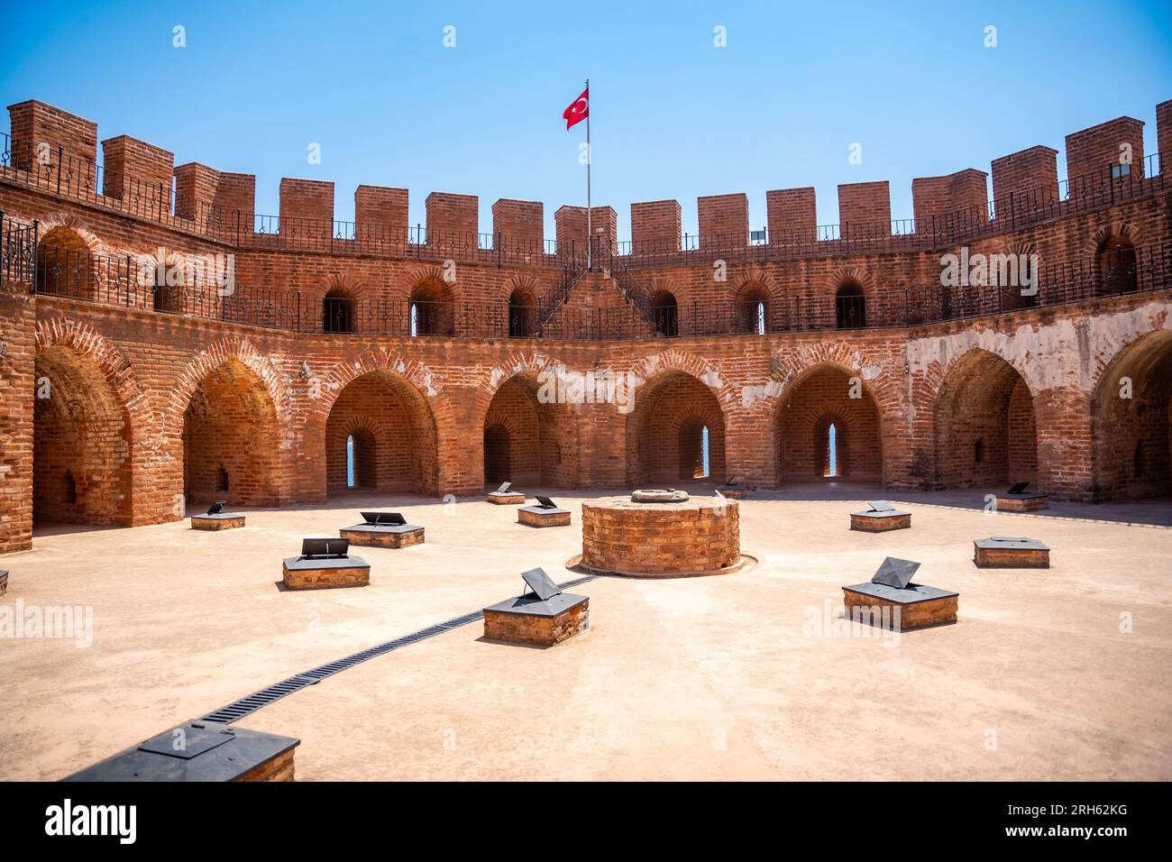 View of Alanya Red Tower in Antalya with orenge bricks, on bright blue ...
