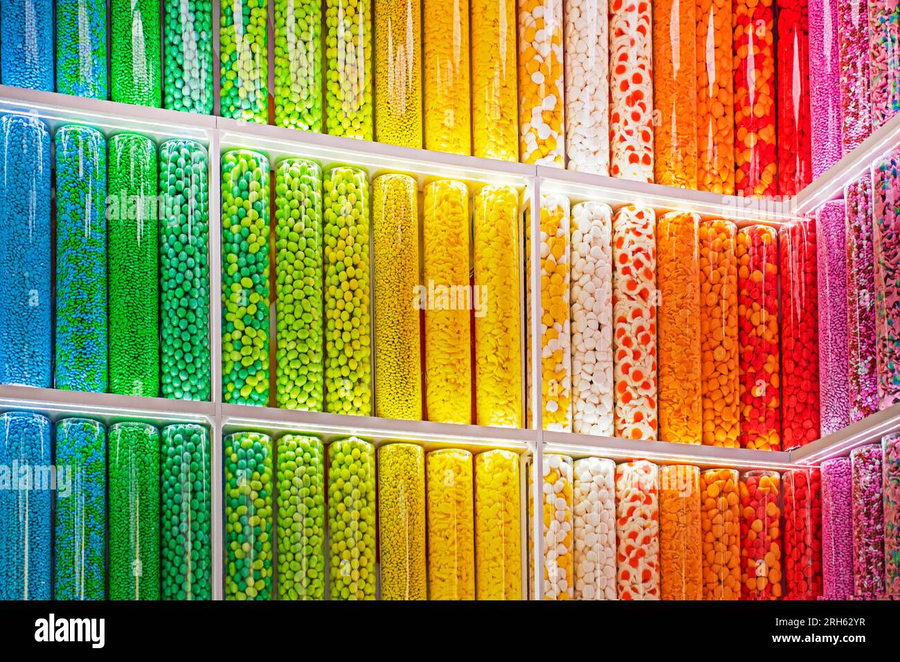 LGBT background of colorful rainbow sweets in transparent containers in ...