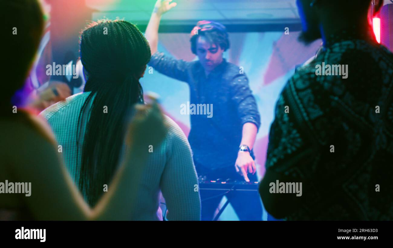 Group of friends dancing in the club, enjoying live performance show ...