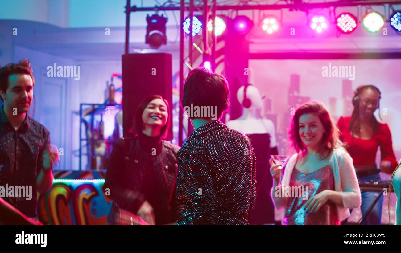 Funky people dancing at discotheque with live disco music, partying ...