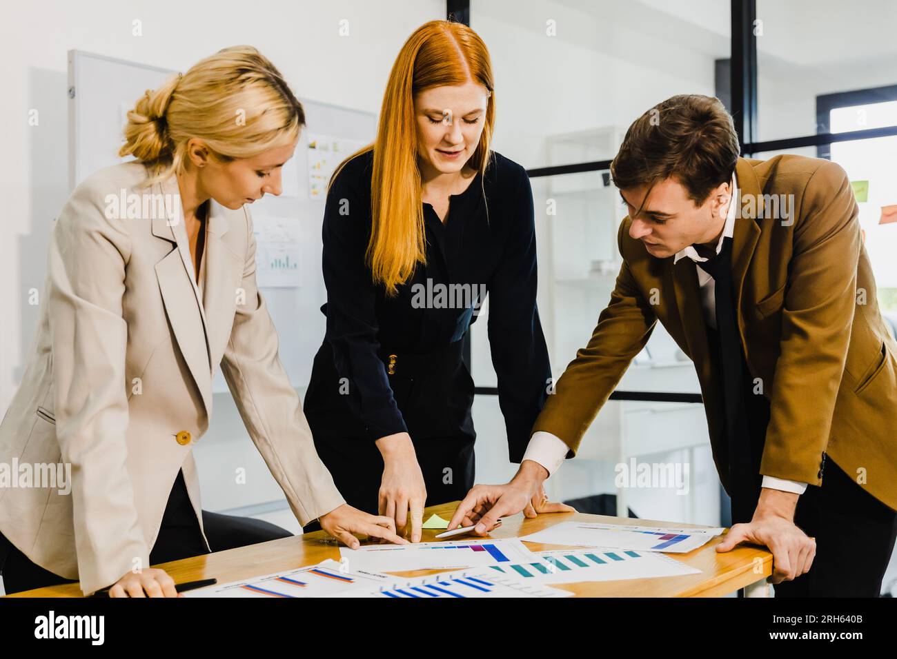 Executive team listening to contrary views from colleague, A group of business people are ...