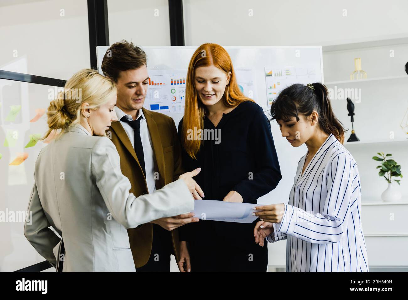 Executive team listening to contrary views from colleague, A group of business people are ...