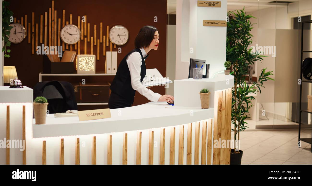 Bellboy receptionist welcoming hotel hi-res stock photography and ...