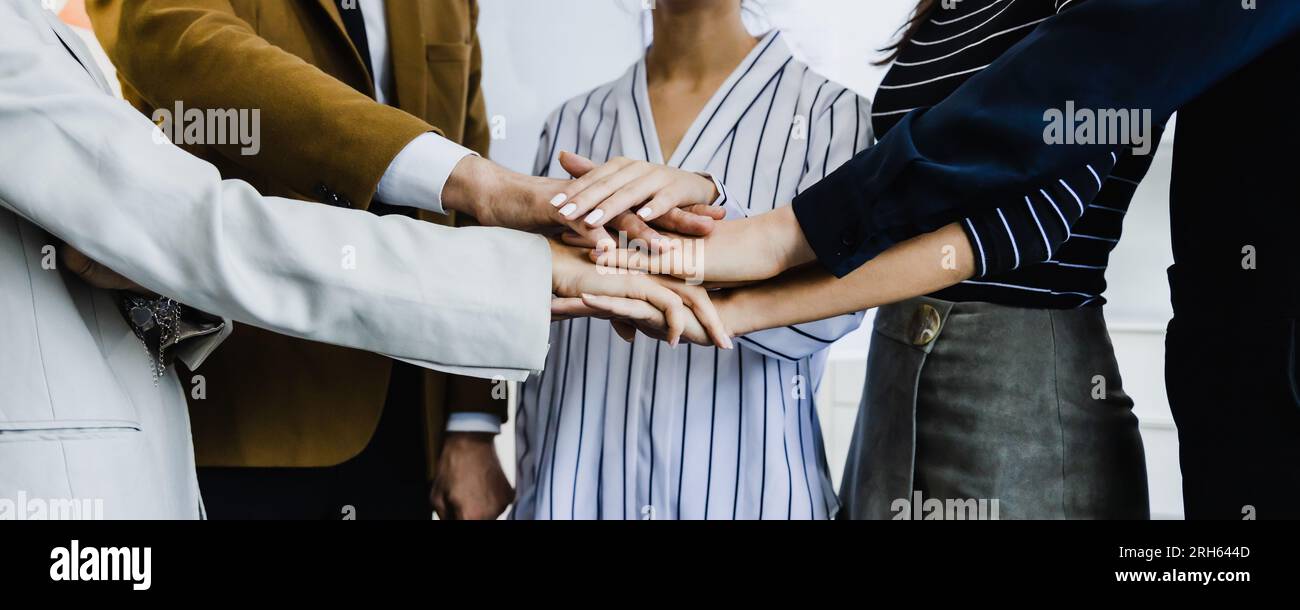 business people putting their hands together, Stack of hands. Unity and teamwork concept Stock ...