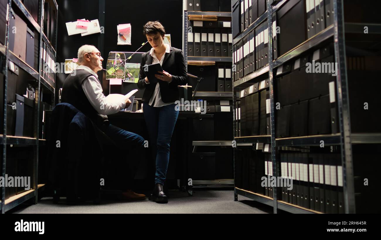 Officers carrying out detective work together with classified police ...