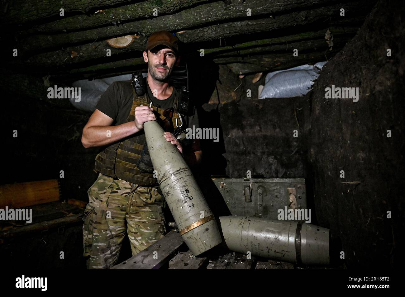 UKRAINE - AUGUST 11, 2023 - A serviceman poses for a photo with a 152mm ...