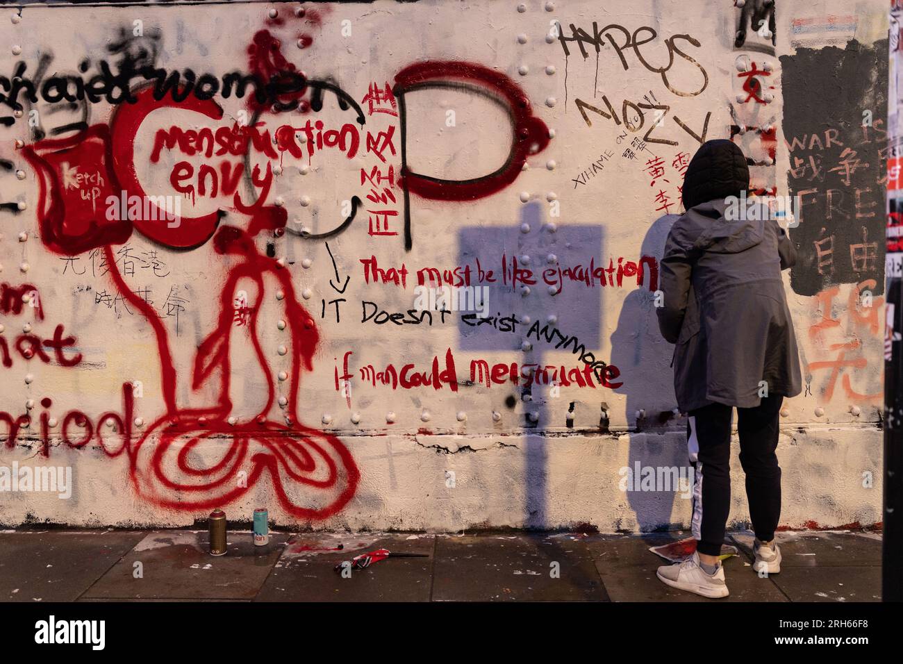 An activist from wearechainwoman paints Anti-Beijing counter-message in ...