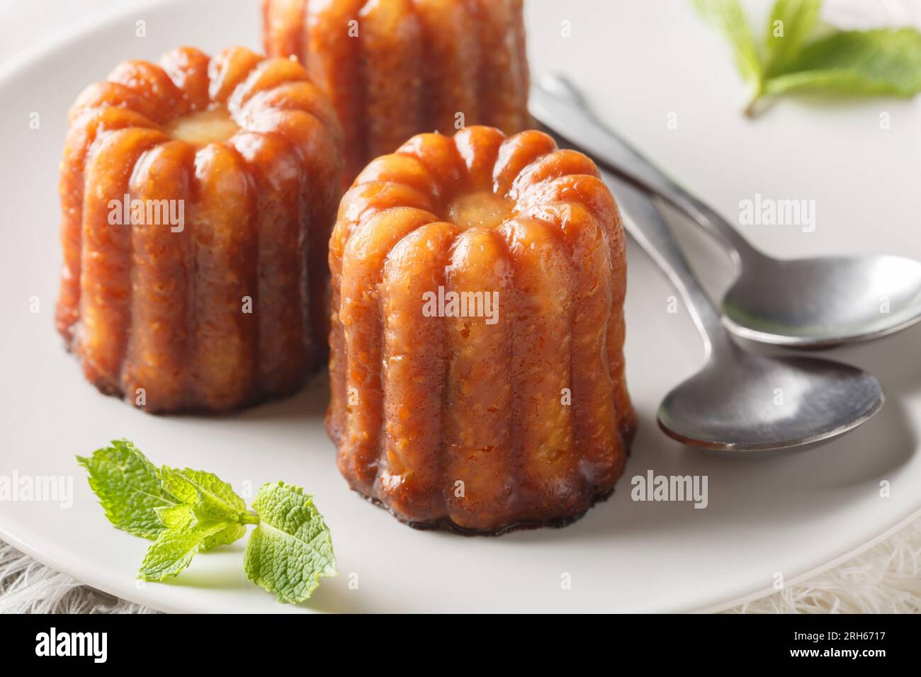 Canele is a small French pastry flavored with rum and vanilla with a ...