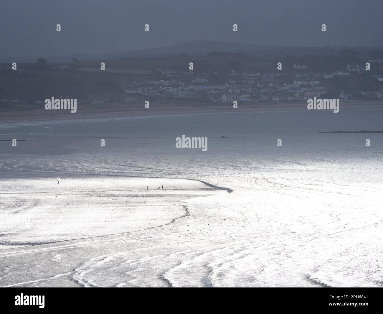 Dramatic Light and Walkers on Long Rock Beach, Penzance, Cornwall ...
