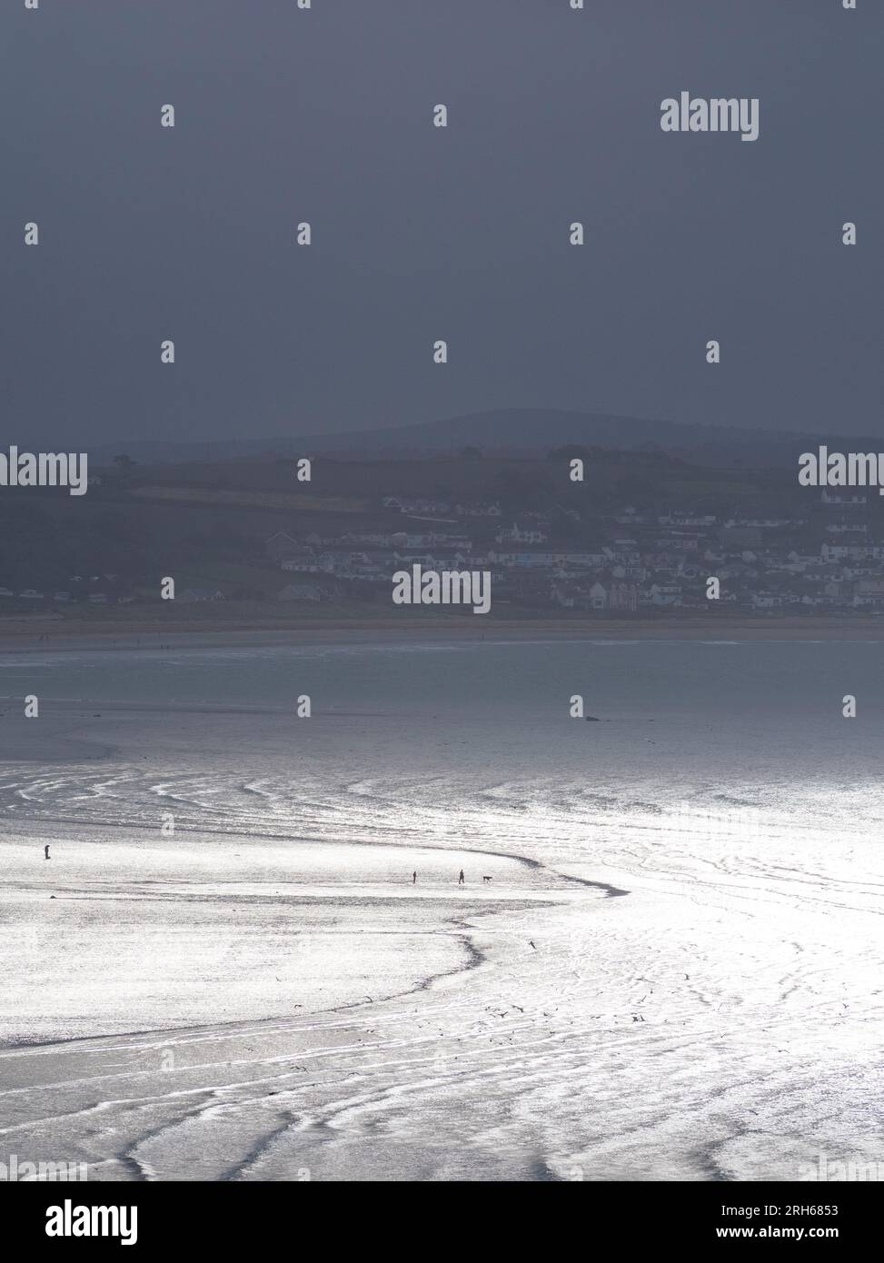 Dramatic Light and Walkers on Long Rock Beach, Penzance, Cornwall ...
