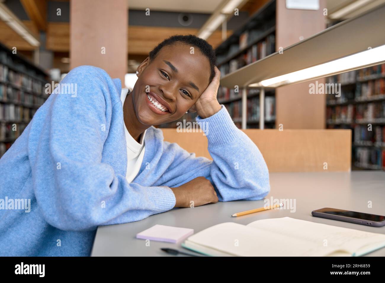 Happy Black African teen girl student sitting at desk. Portrait Stock ...