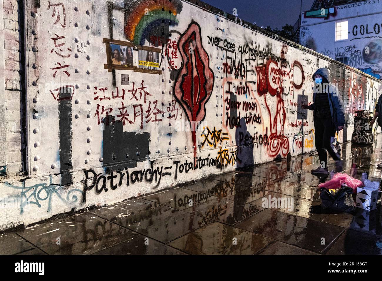 London, UK. 8th Aug, 2023. An activist from wearechainwoman paints Anti ...