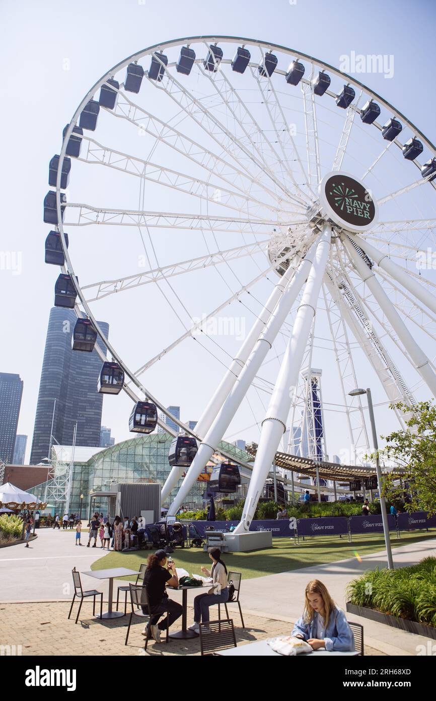 Navy Pier Centennial wheel with tourists around and a wide angle lens ...