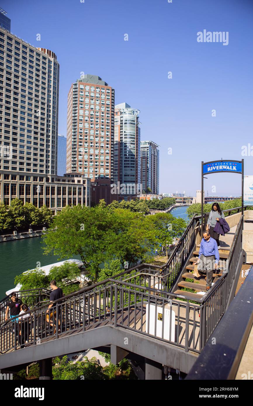 Chicago Riverwalk stairs with people going down viewed from Wacker Dr ...