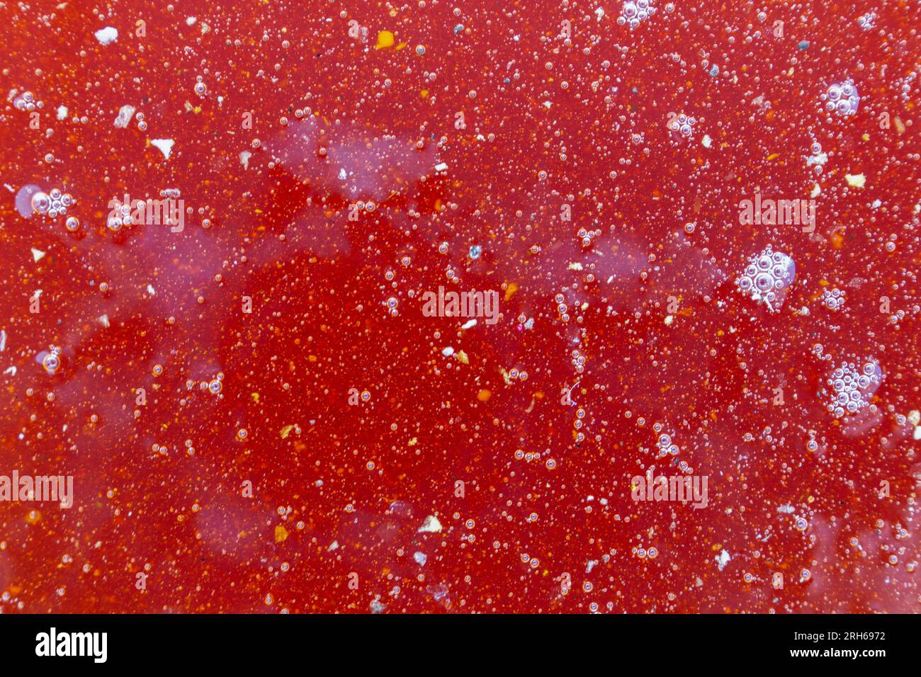 Texture of dark red fresh honey. Fresh buckwheat honey. Top view ...