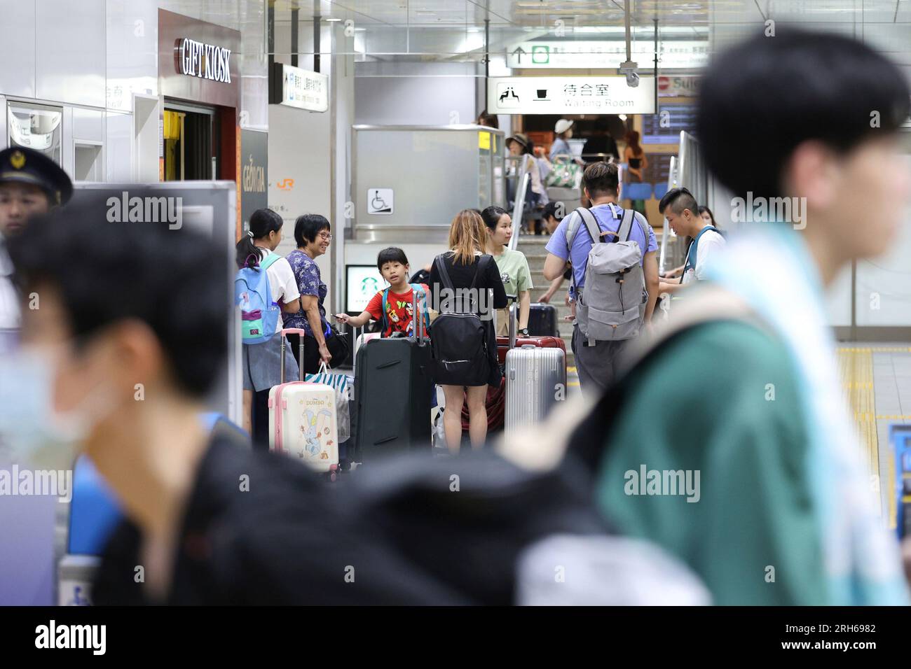 Passengers are pictured while Typhoon No.7 (Lan) approaching the main ...