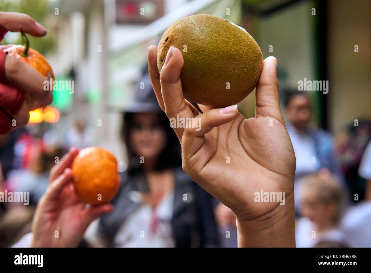 multiethnic kids hands showing fruits on a healthy trick or treat ...