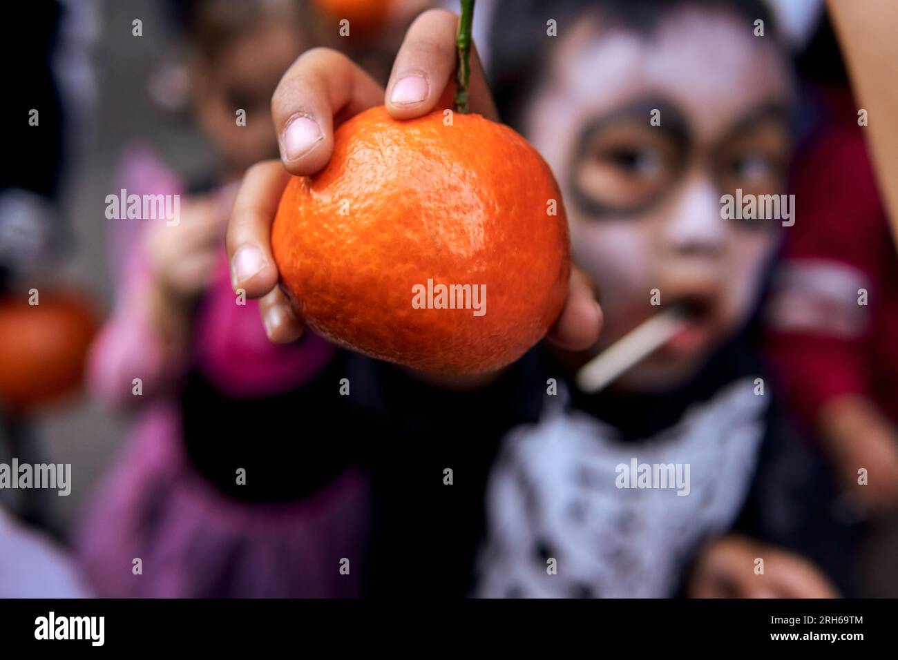 multiethnic kids hands showing fruits on a healthy trick or treat in ...