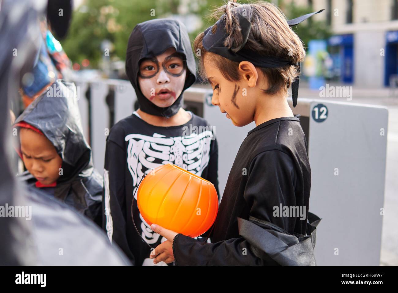 Diverse Group of Kids Enjoying Halloween Trick or Treat in the city ...