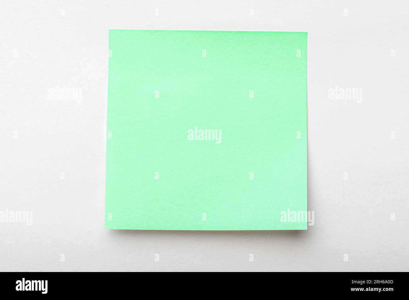 blank green sticky notes on white background. Discussing business ...