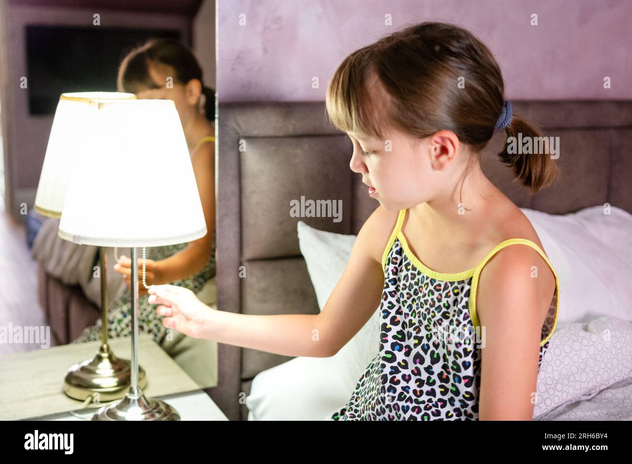 Child turning light off hi-res stock photography and images - Alamy