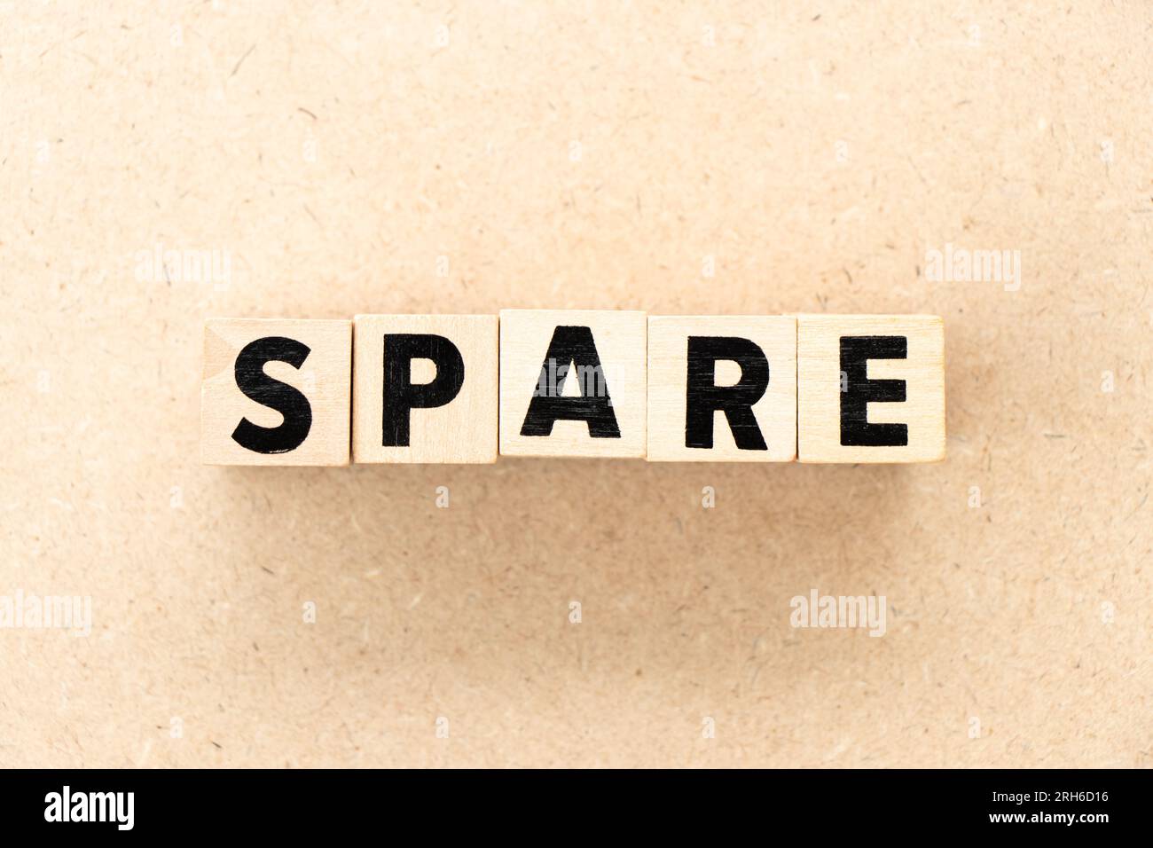 Alphabet letter block in word spare on wood background Stock Photo - Alamy