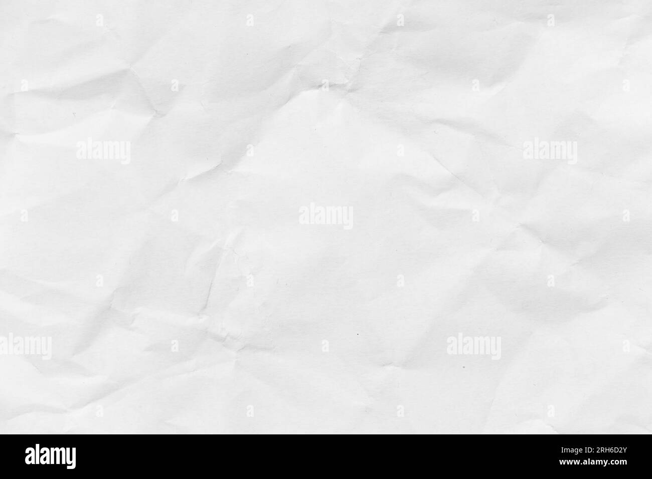 Grunge wrinkled white color paper textured background with copy space ...