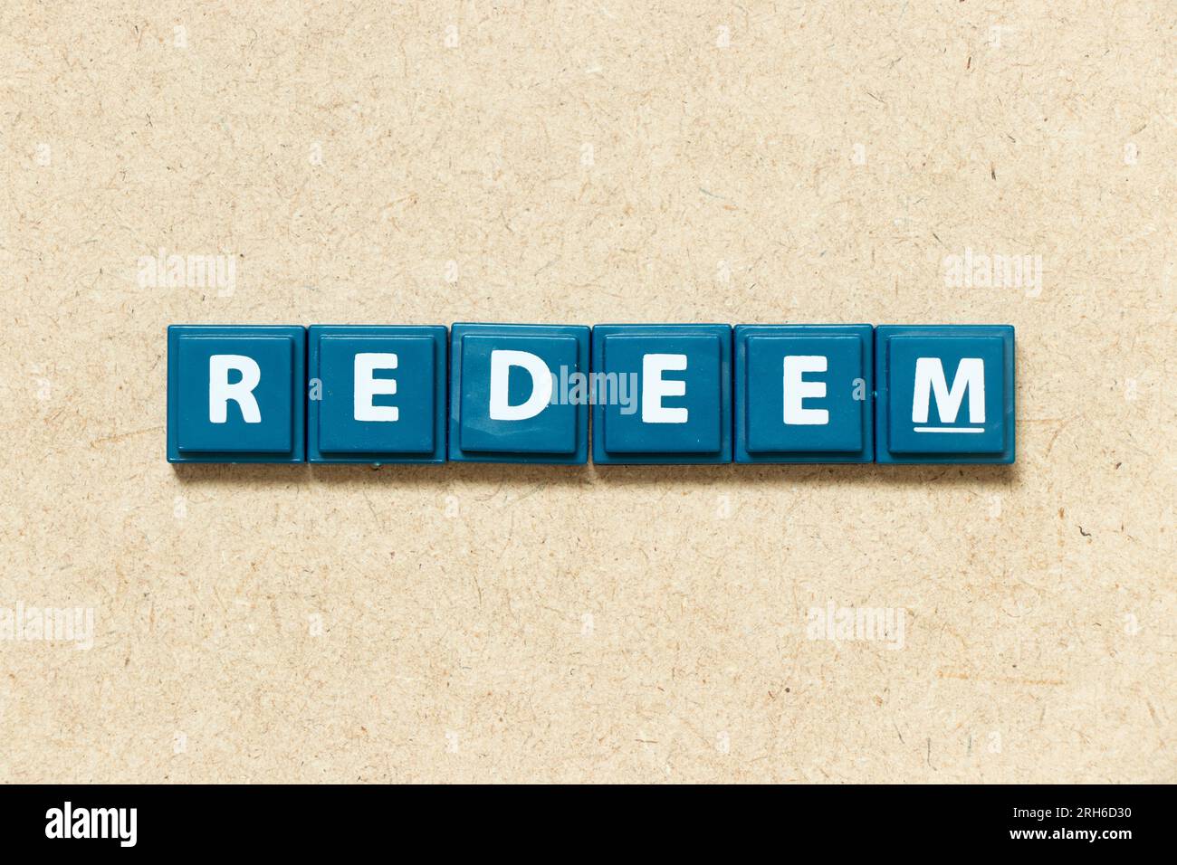 Tile alphabet letter in word redeem on wood background Stock Photo - Alamy