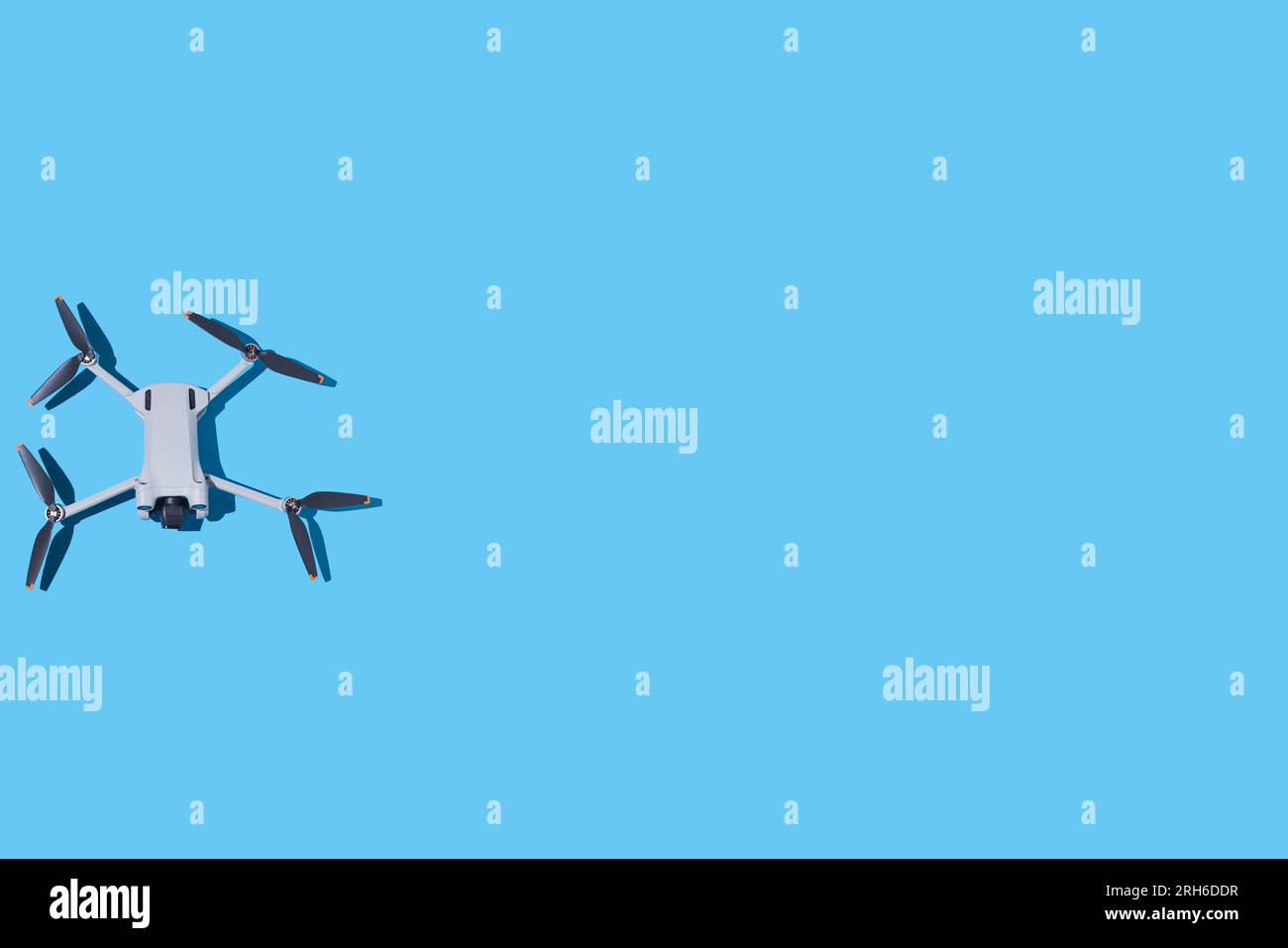 Gray drone, with photo and video camera, and dark propellers, on the ...