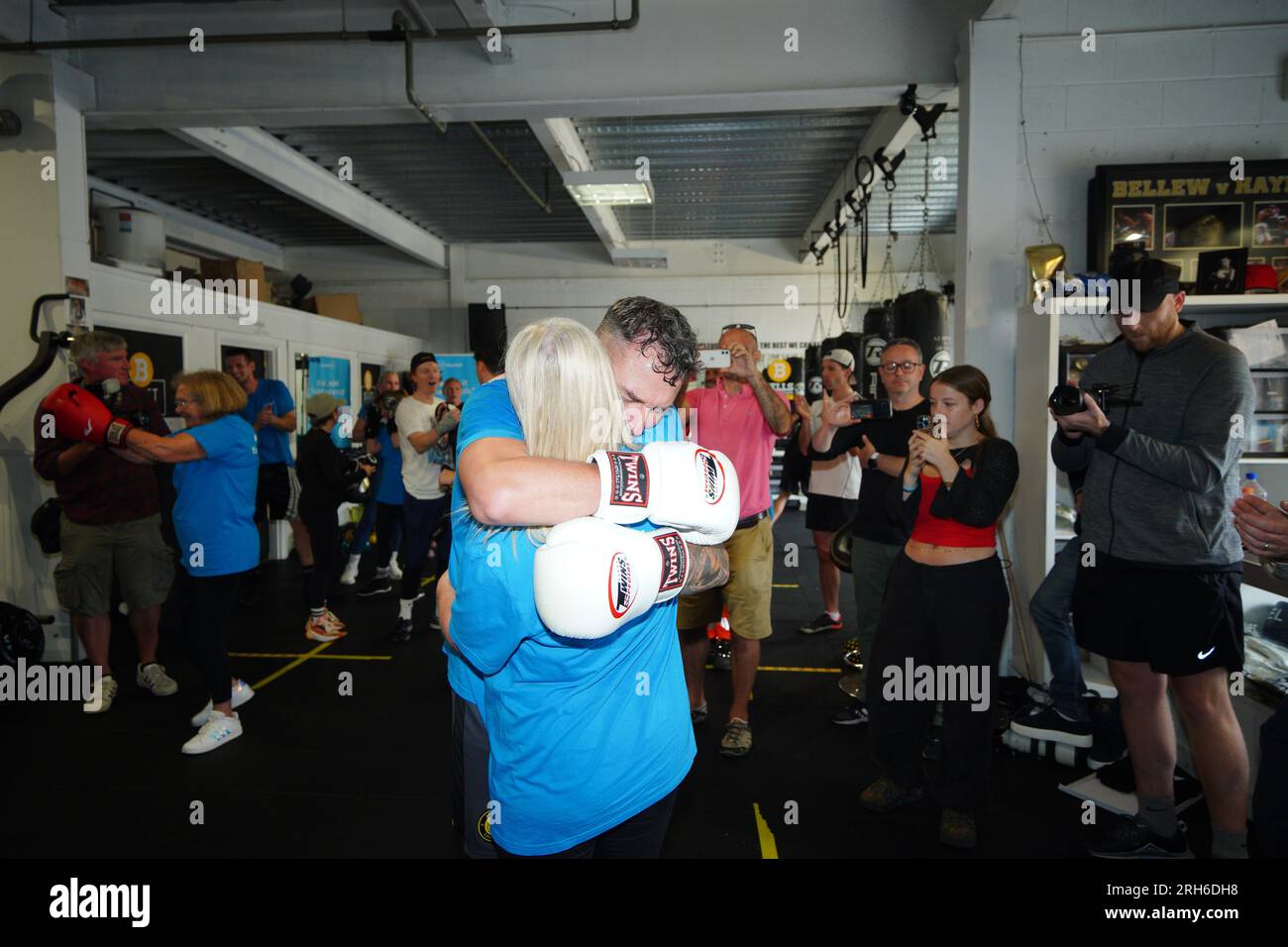 Dave Thompson hugs his wife Caroline at the end of his boxing marathon ...