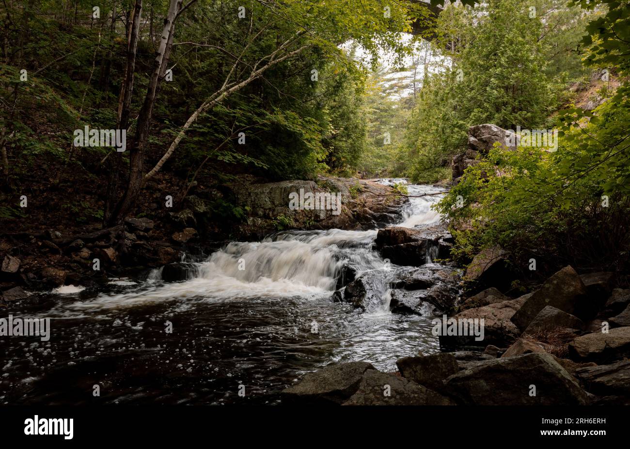 Scenic landscape with a waterfall Stock Photo - Alamy