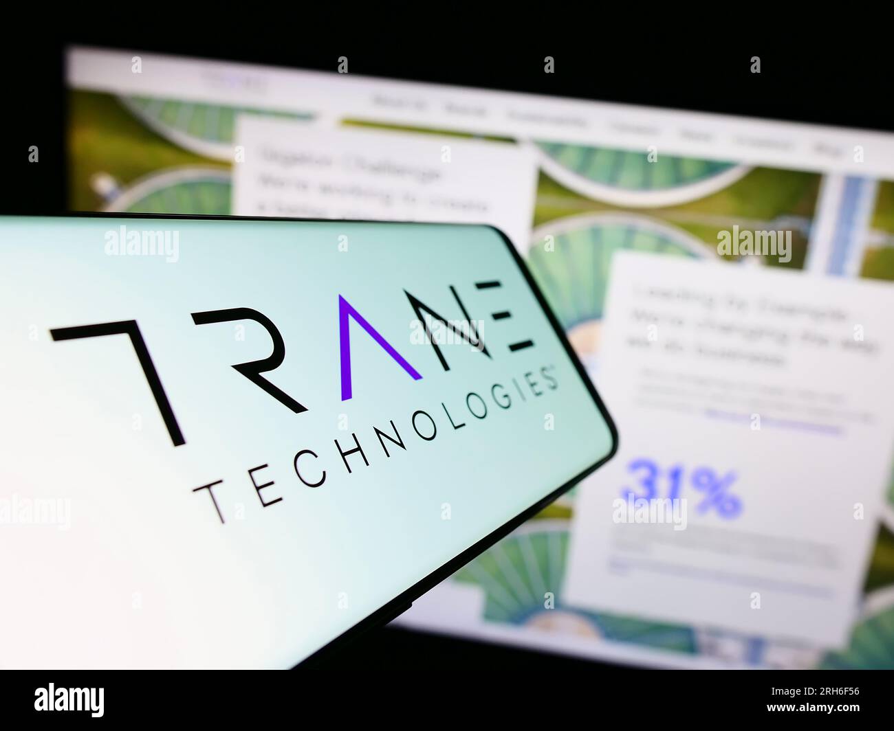 Smartphone with logo of Irish company Trane Technologies plc on screen in front of business ...