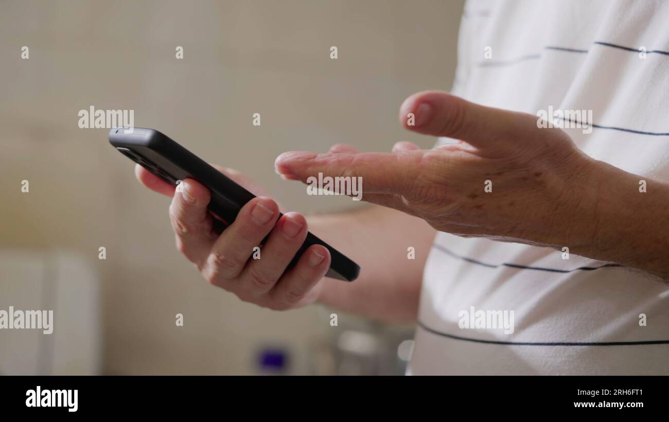 Close-up senior man hands holding cellphone device gesturing. Older ...