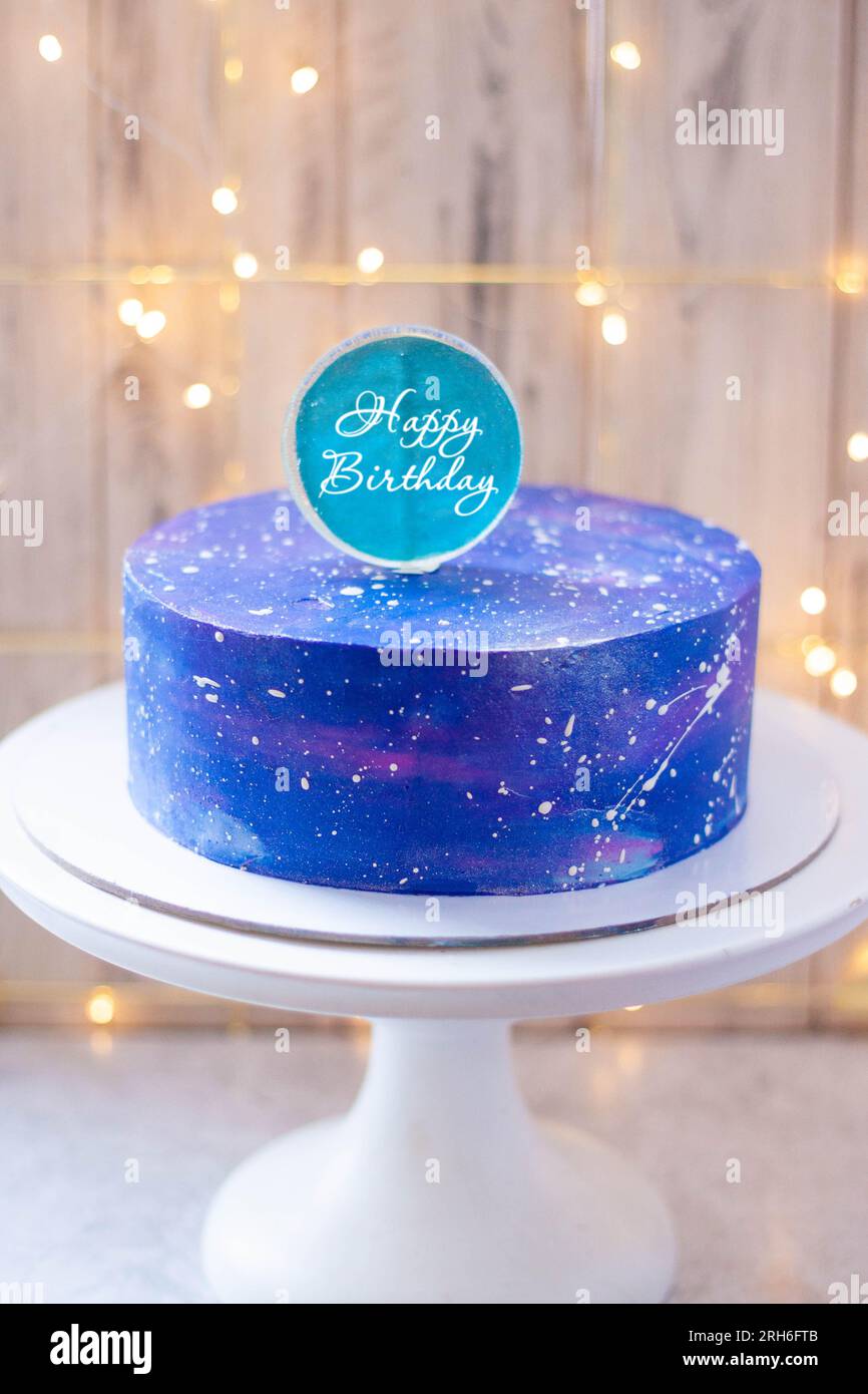 Birthday blue cosmic cake on festive background with text Happy ...