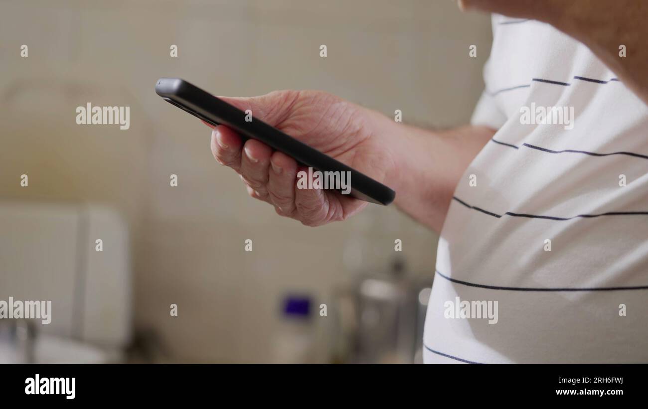 Close-up senior man hands holding cellphone device gesturing. Older ...