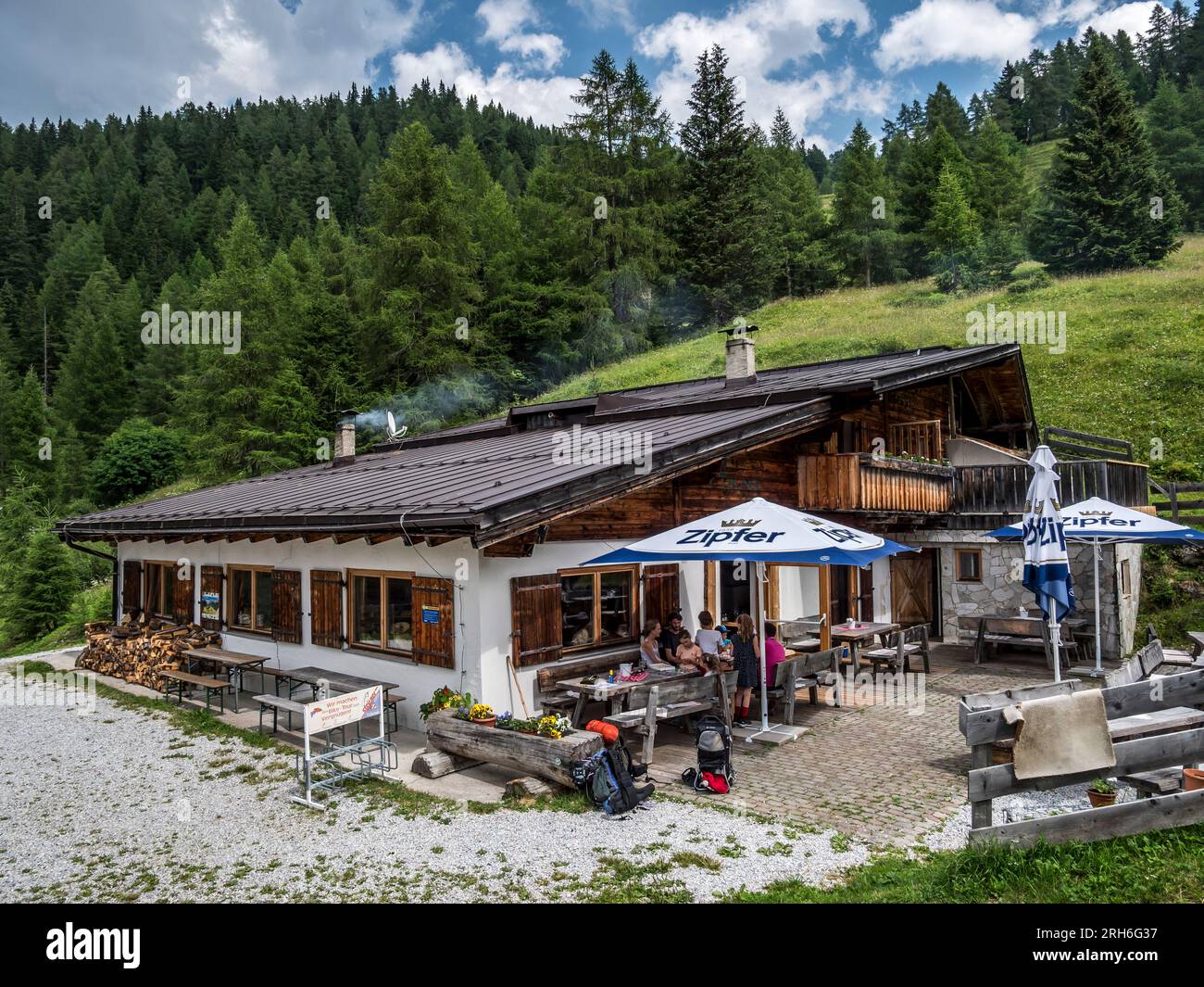 The image is of the privately owned Truner Hut mountain refuge located ...