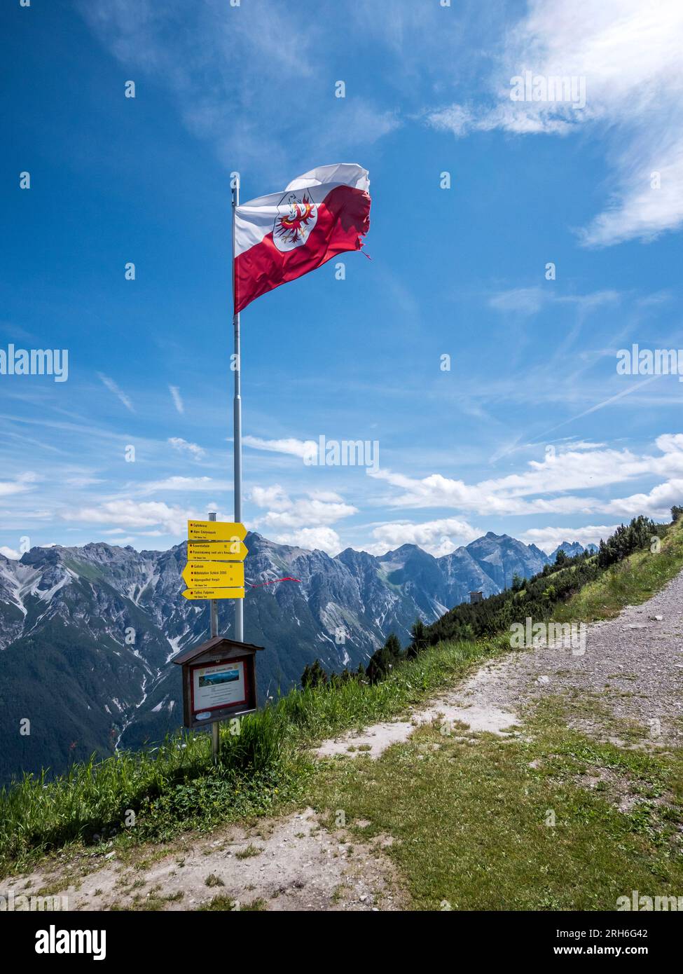 Panoramic image with Austrian flag looking towards the Serleskamm ...