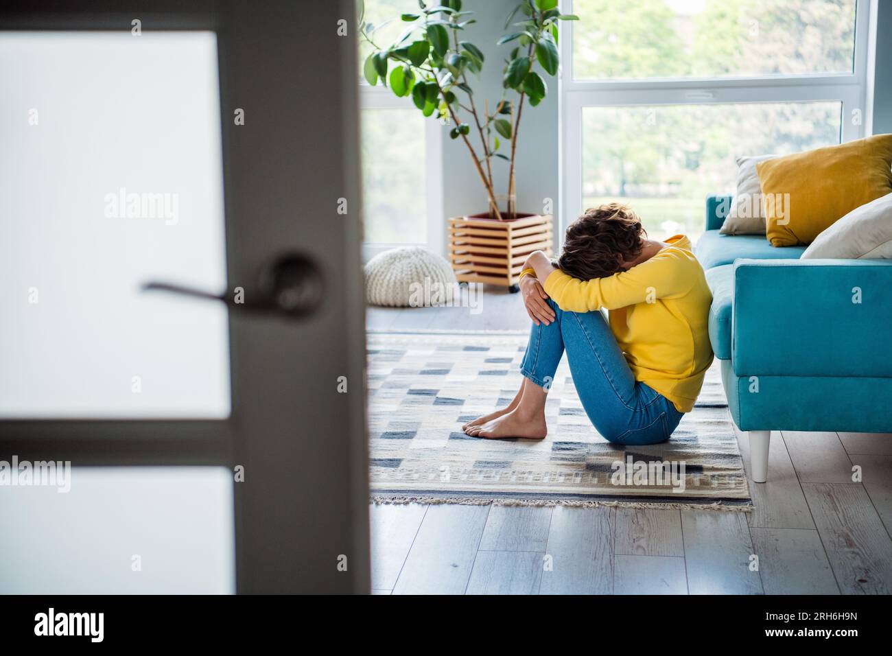 Photo of unhappy lady sitting floor in empty room house crying struggle ...