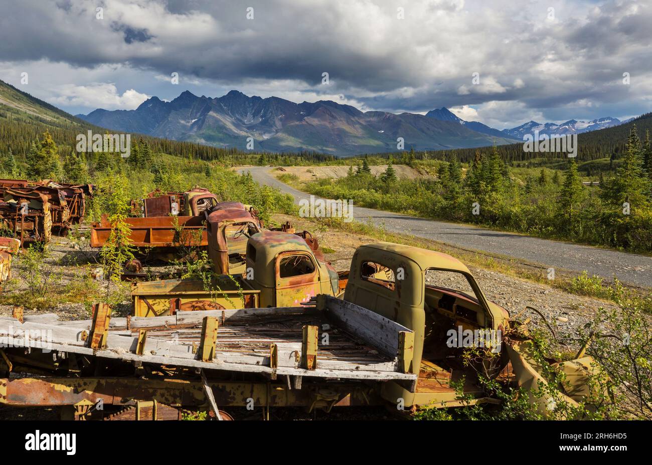 An array of abandoned rusty post war trucks that lay rusting away in ...